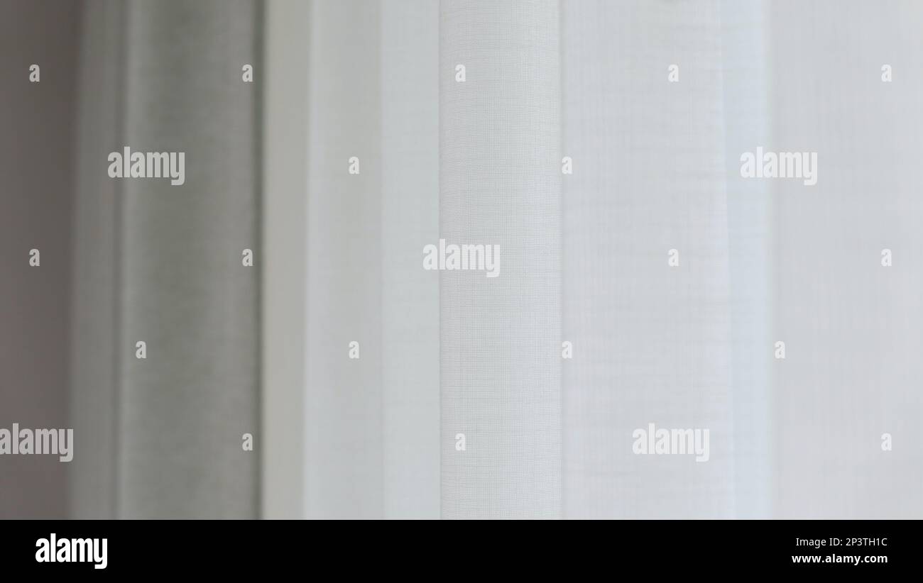 Voile curtain in front of window with grey curtain to side Stock Photo ...