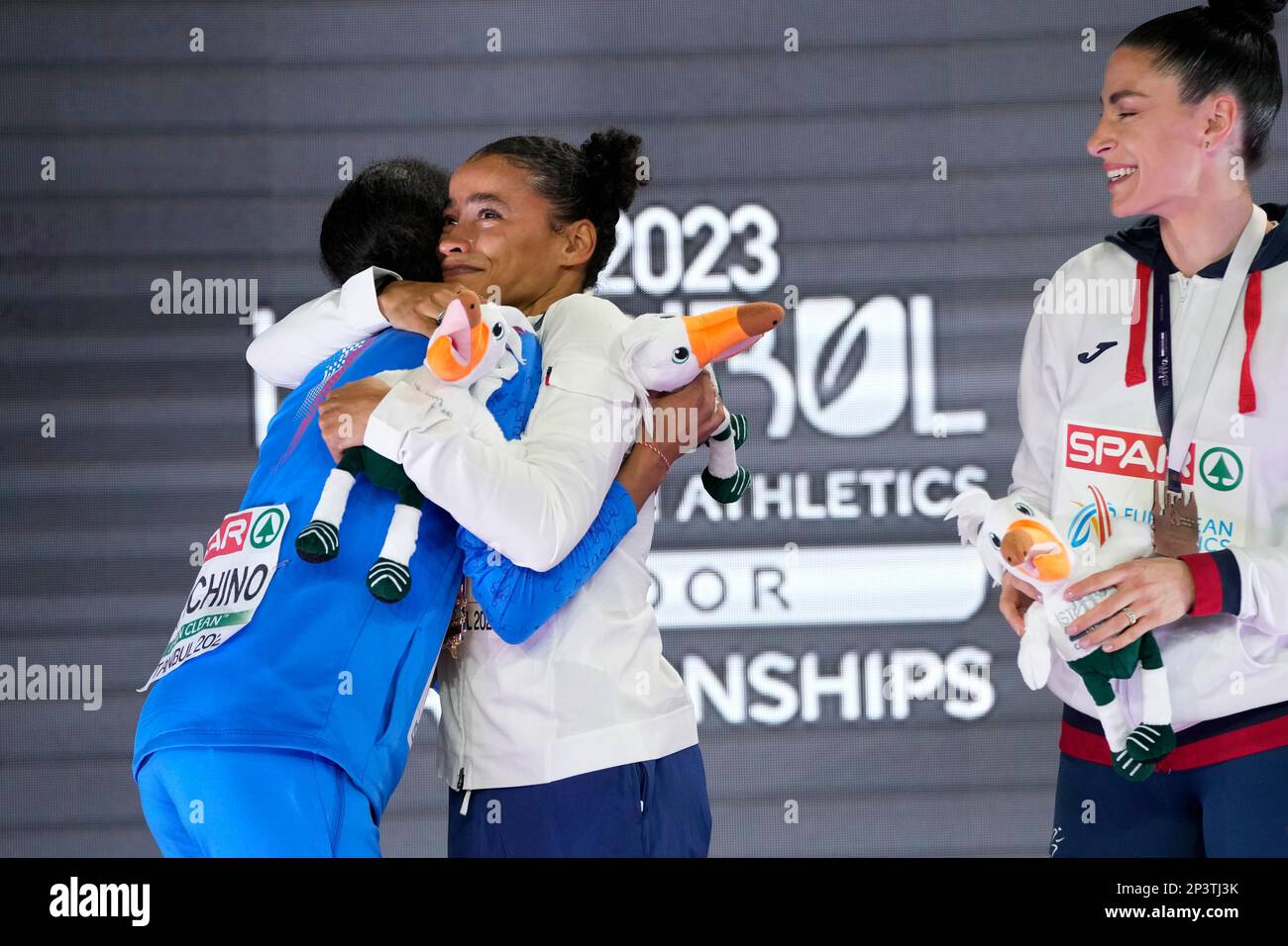 Silver medalist Larissa Iapichino, of Italy, left, hugs gold medalist ...