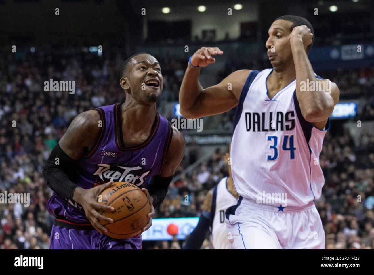 Toronto Raptors' Terrence Ross, left, drives at Dallas Mavericks ...