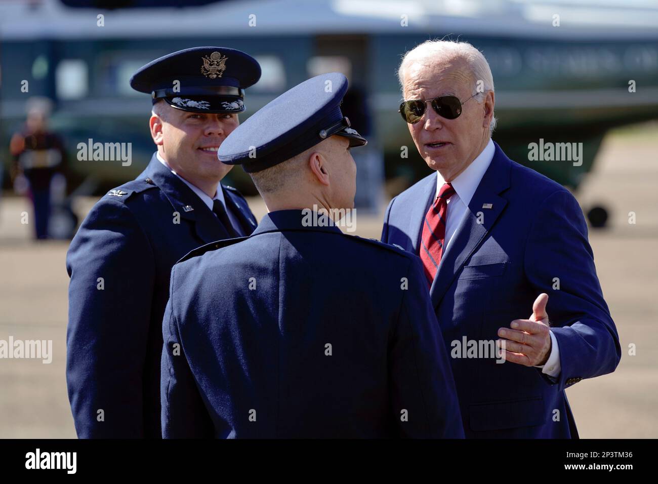 President Joe Biden talks with Maj. Gen. William Holt II, center, and ...