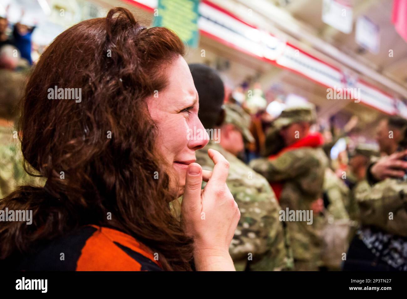 Laura De La Garza reacts to seeing her husband at a homecoming ceremony ...