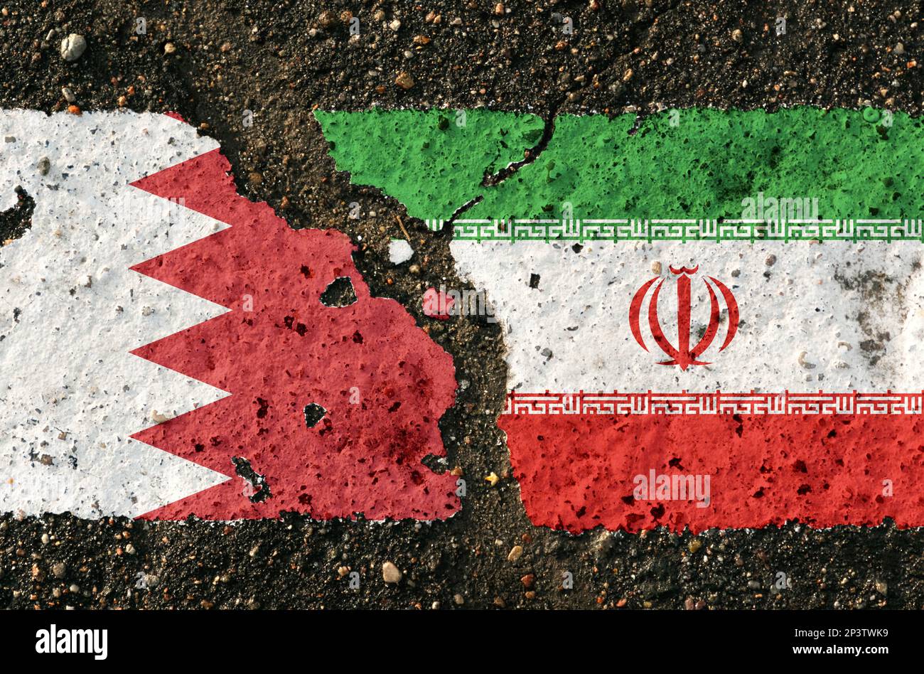 On the pavement are images of the flags of Bahrain and Iran, as a ...
