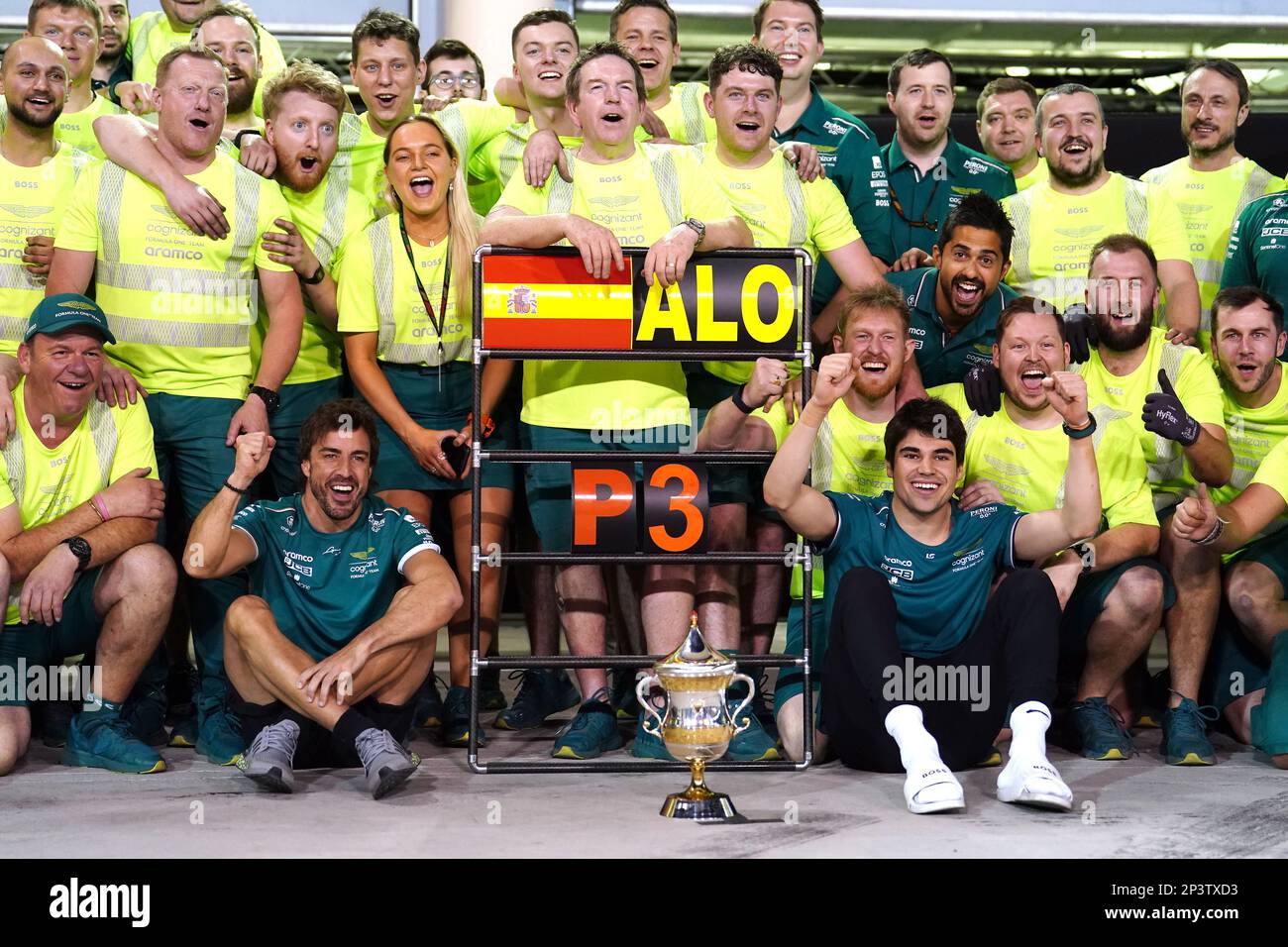 Third place Aston Martin's Fernando Alonso (bottom, second left ...