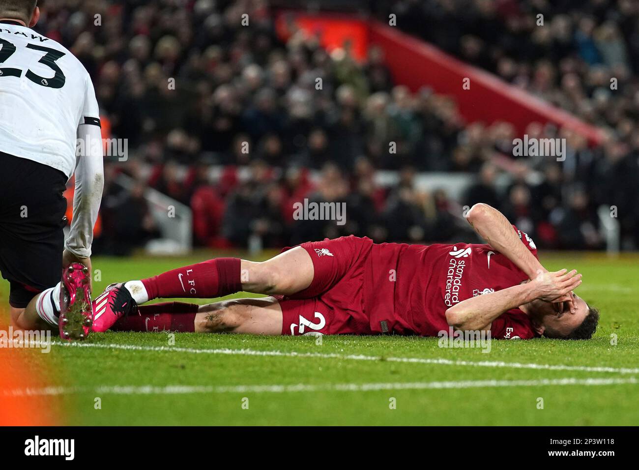 Liverpool's Diogo Jota appears in pain after a collision during the ...