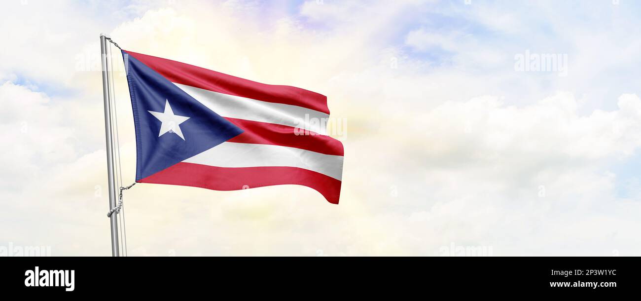 Puerto Rico flag waving on sky background. 3D Rendering Stock Photo - Alamy