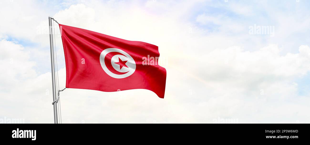 Tunisia flag waving on sky background. 3D Rendering Stock Photo - Alamy