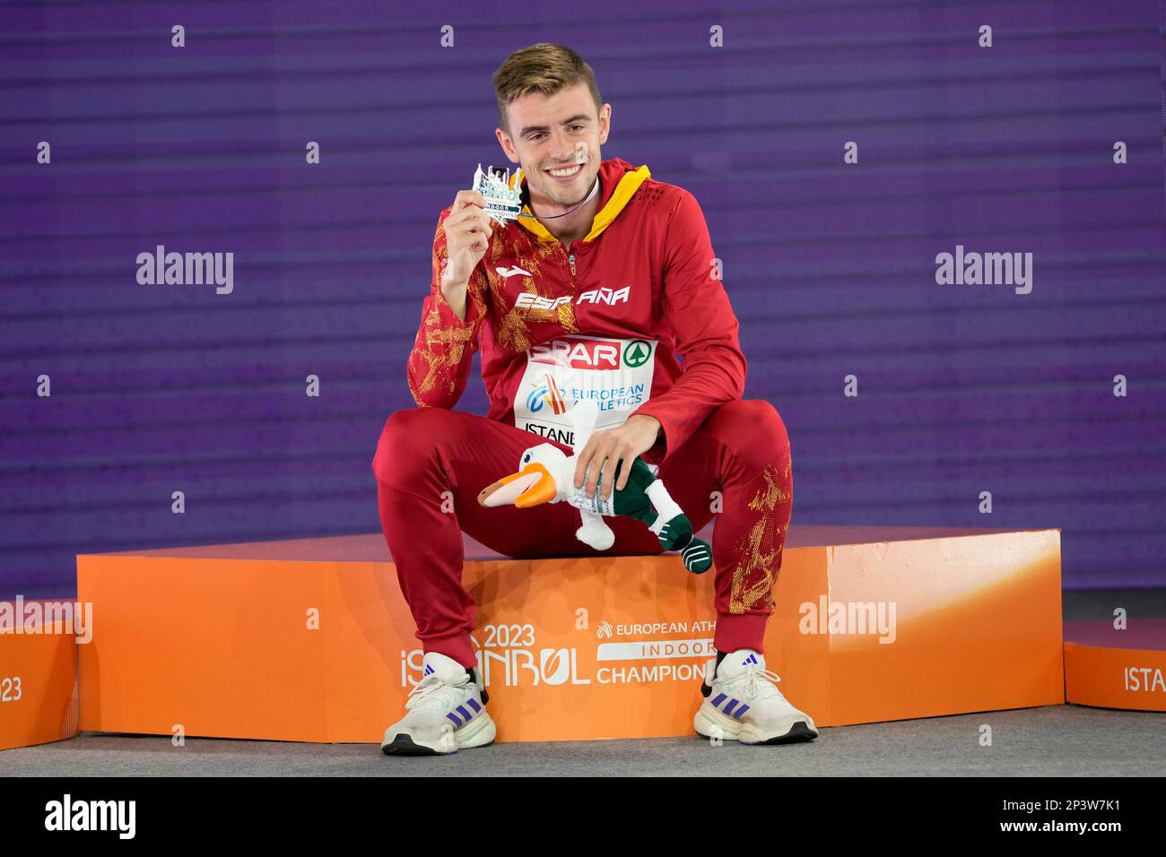Adrian Ben, of Spain, poses on the podium after winning the gold medal ...