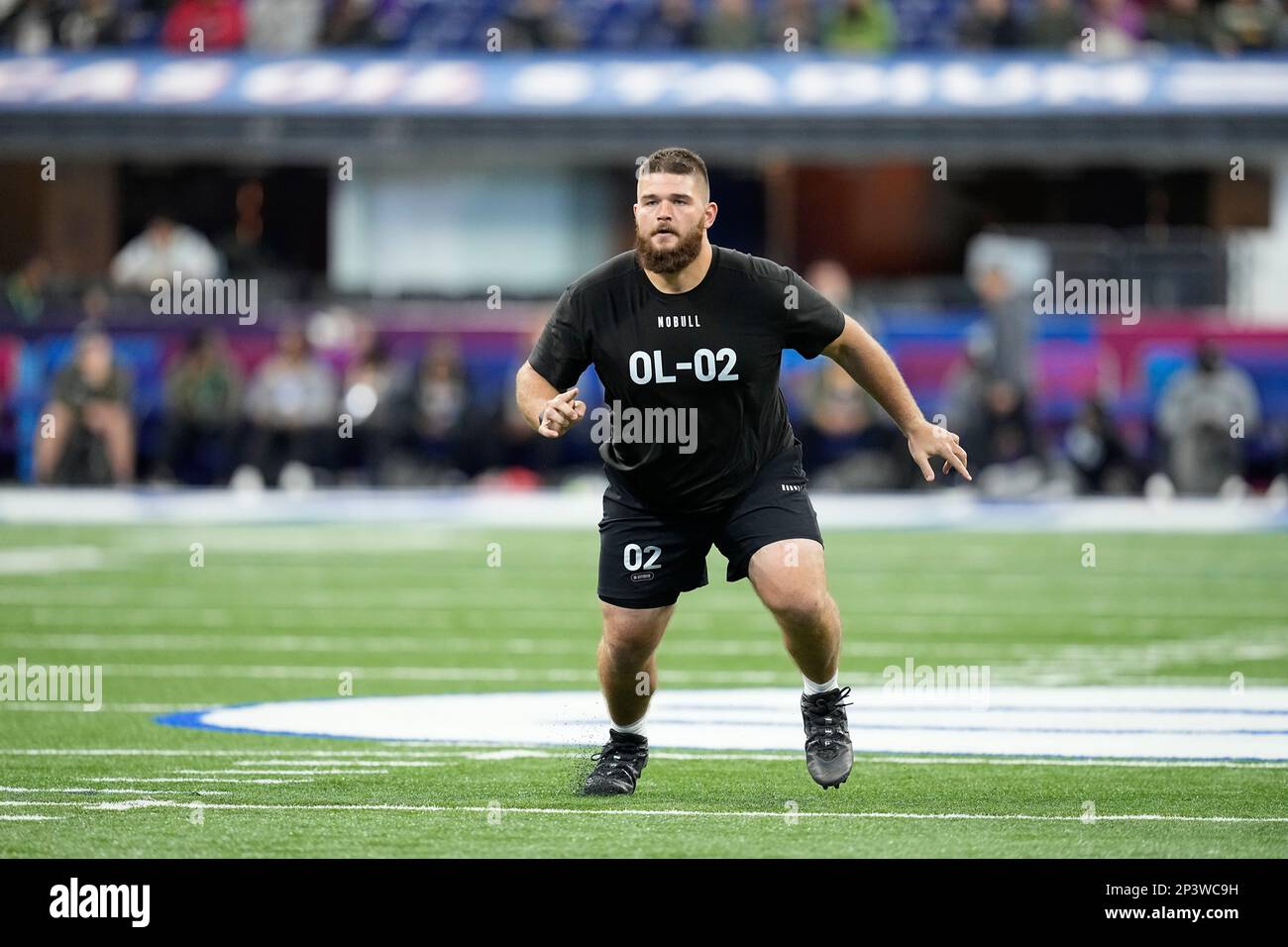 Troy offensive lineman Jake Andrews runs a drill at the NFL football ...
