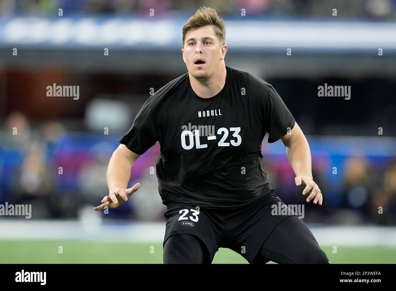 Michigan offensive lineman Ryan Hayes runs a drill at the NFL football ...