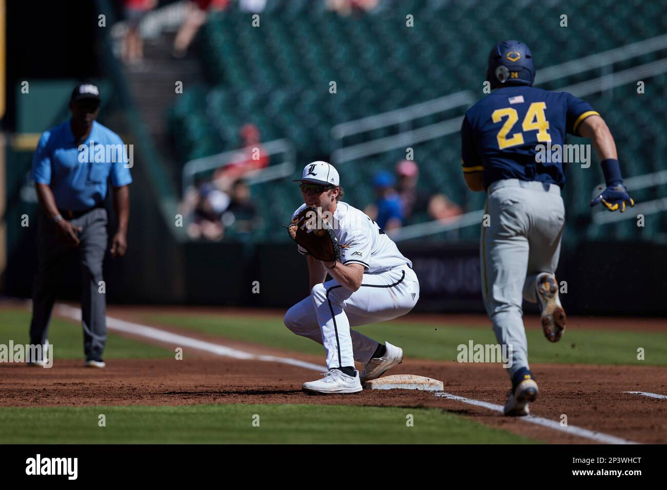 Louisville Cardinals first baseman Ryan McCoy (30) fields a throw as ...