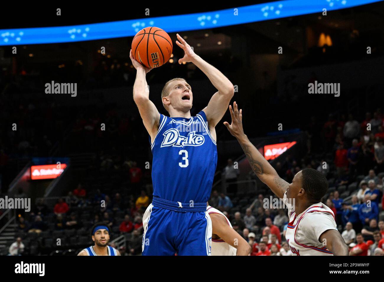 Drake guard Garrett Sturtz (3) shoots as Bradley guard Duke Deen, right ...