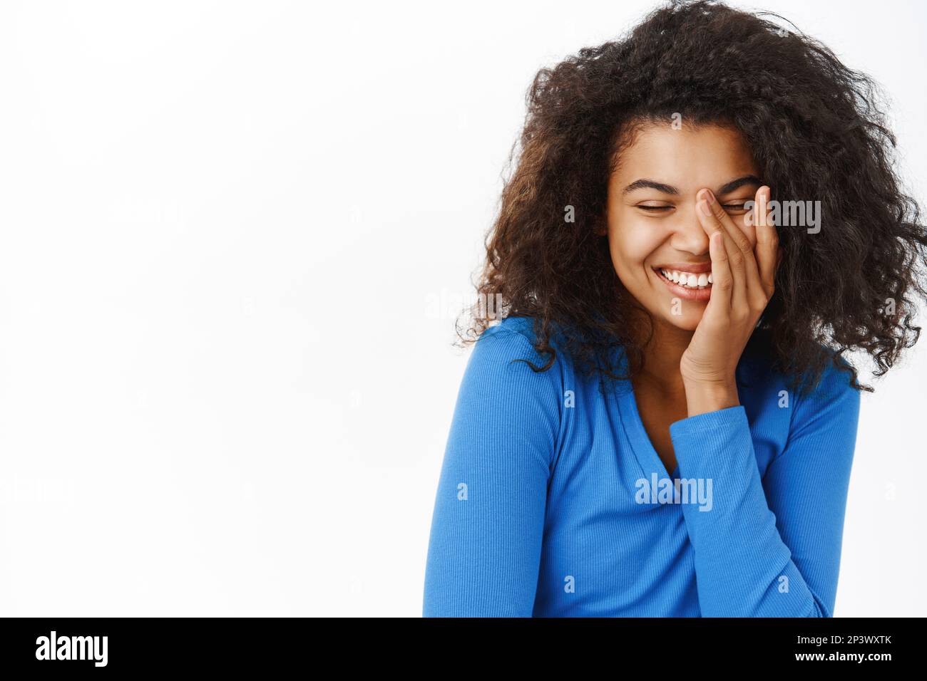 Portrait of beautiful, romantic girl laughing, smiling and covering her ...