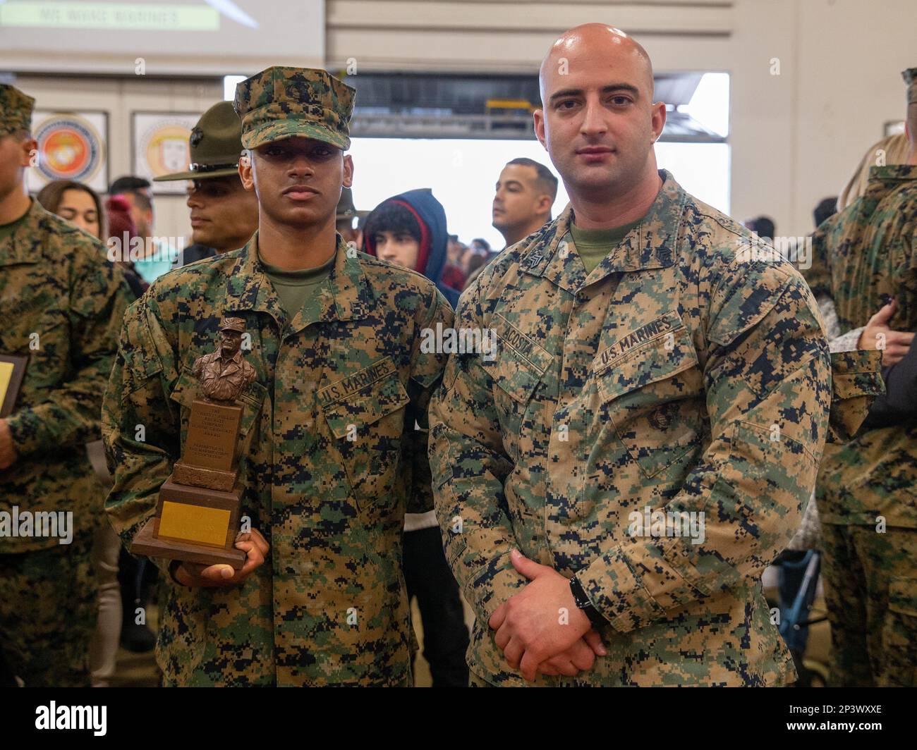 U.S. Marine Corps Sgt. Luis E. Acosta, right, a recruiter with ...