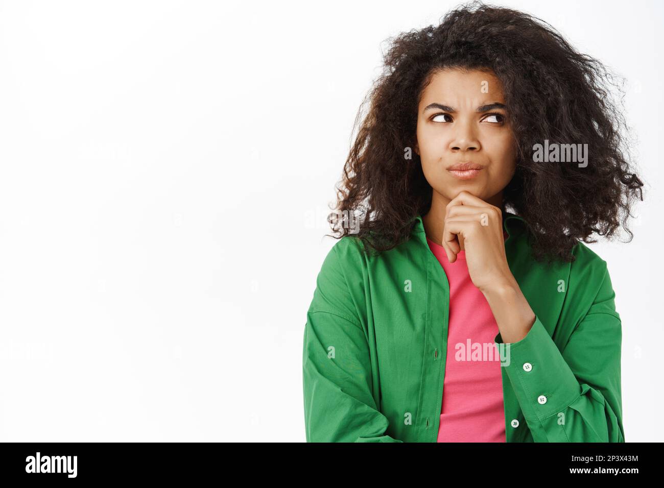 Portrait of girl with thoughtful face, thinking of something, pondering ...