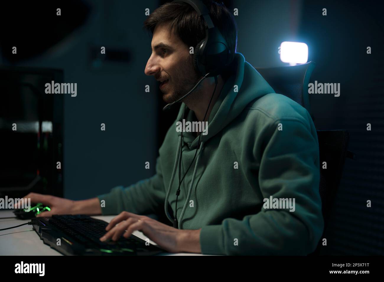 Focused professional gamer playing hi-res stock photography and images ...
