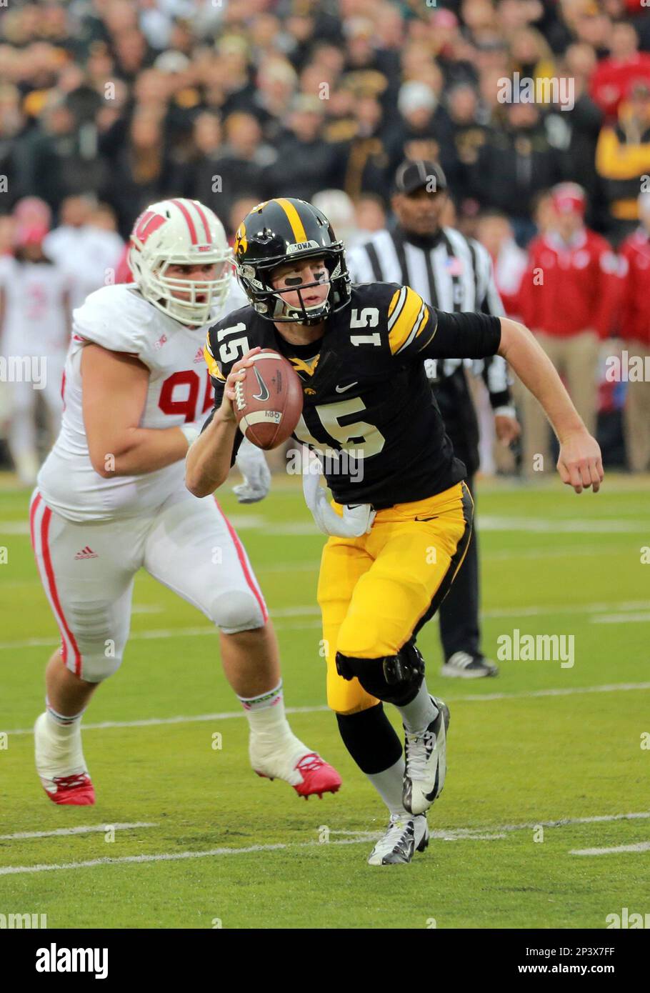 22 November, 2014 - Iowa Hawkeyes quarterback Jake Rudock (15) runs the ...