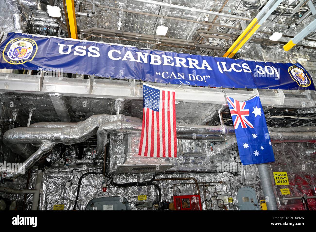 A banner is hung inside the hangar of the Independence-class littoral ...