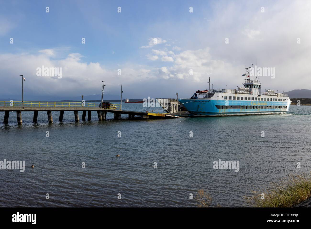 Blue and white ferry at the port of Puerto Natales, Patagonia, Chile ...