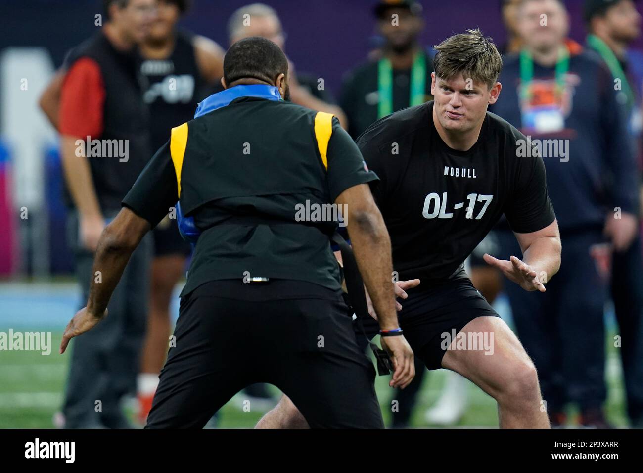 BYU offensive lineman Blake Freeland runs a drill at the NFL football ...