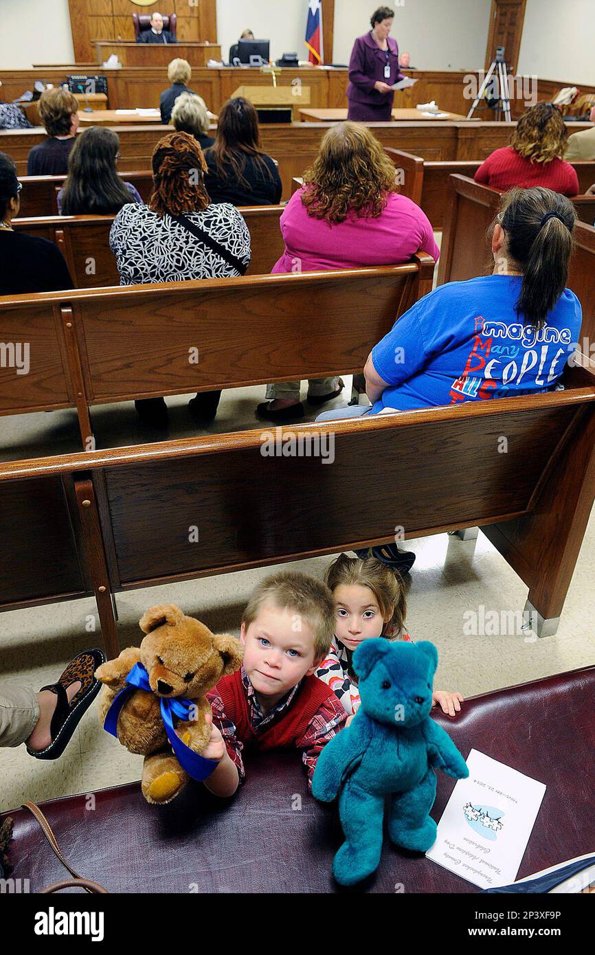 Charlie Stephens, 4, left, and his sister Dacey Stephens, 6, play with ...