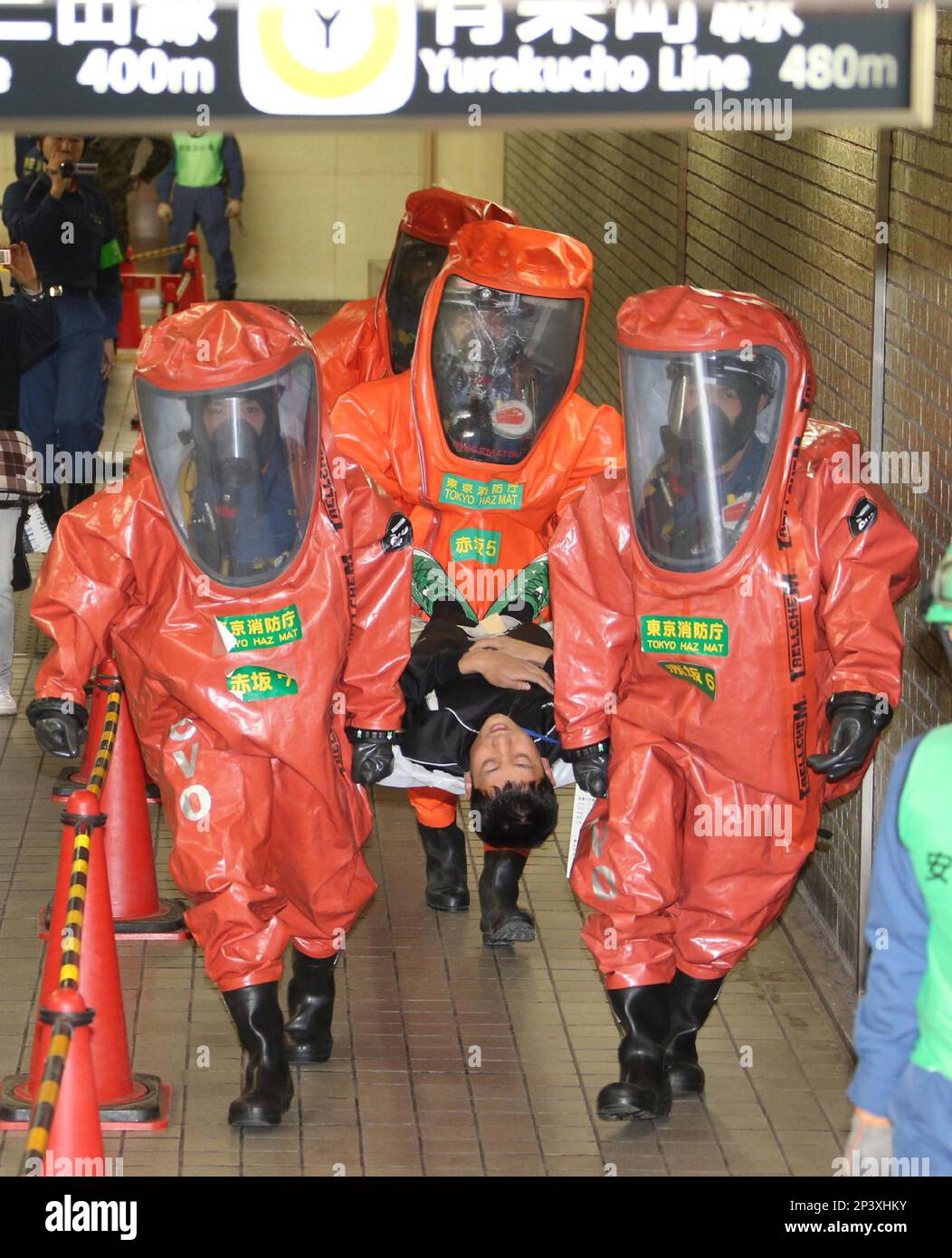 Rescuers carry a "victim of a simulated sarin gas attack in a ...