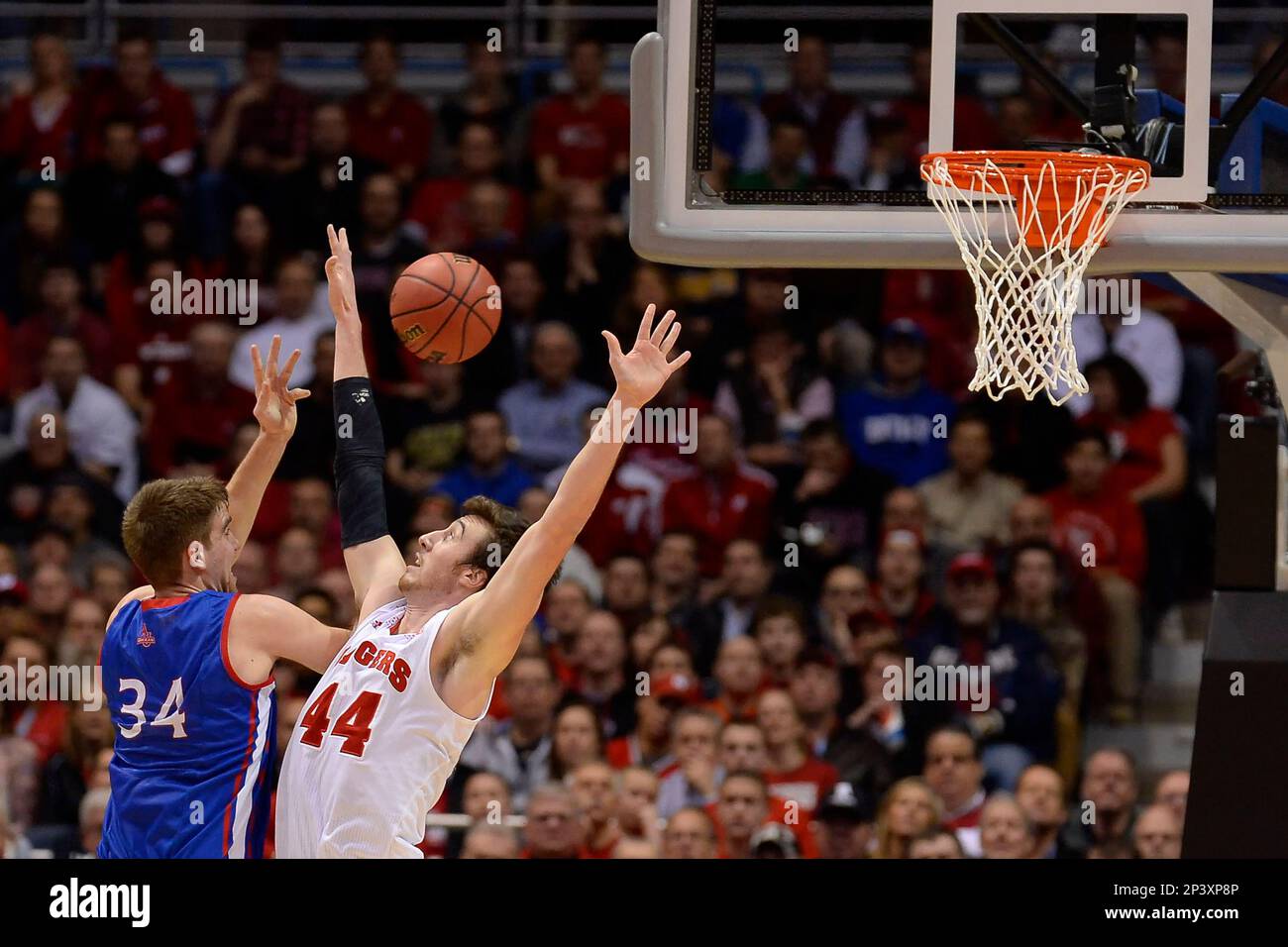 20 March 2014: Wisconsin Badgers forward Frank Kaminsky (44) battles ...