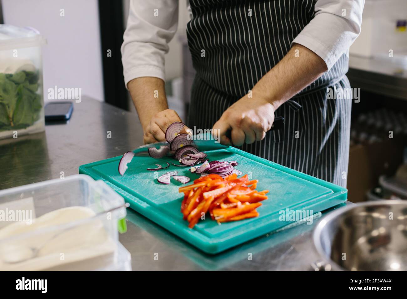 Close up, male chef cuts vegetables in restaurant Stock Photo - Alamy