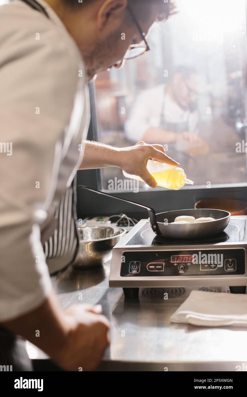 Сooking food, profession and people concept - male chef cook with ...