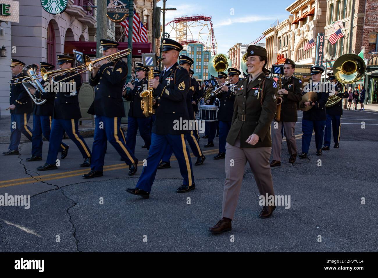 The 3rd Infantry Division Band plays music as they march through ...