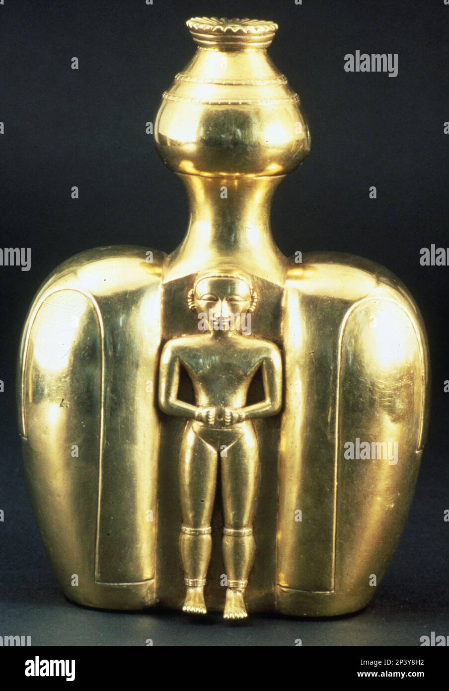 Anthropomorphic gold figure used as a vessel for lime, depicting two ...