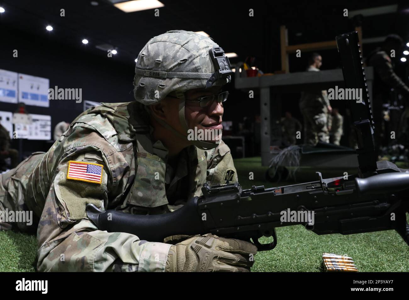 U.S. Army Spc. Angel Hernandez, an allied trade specialist, fires a ...