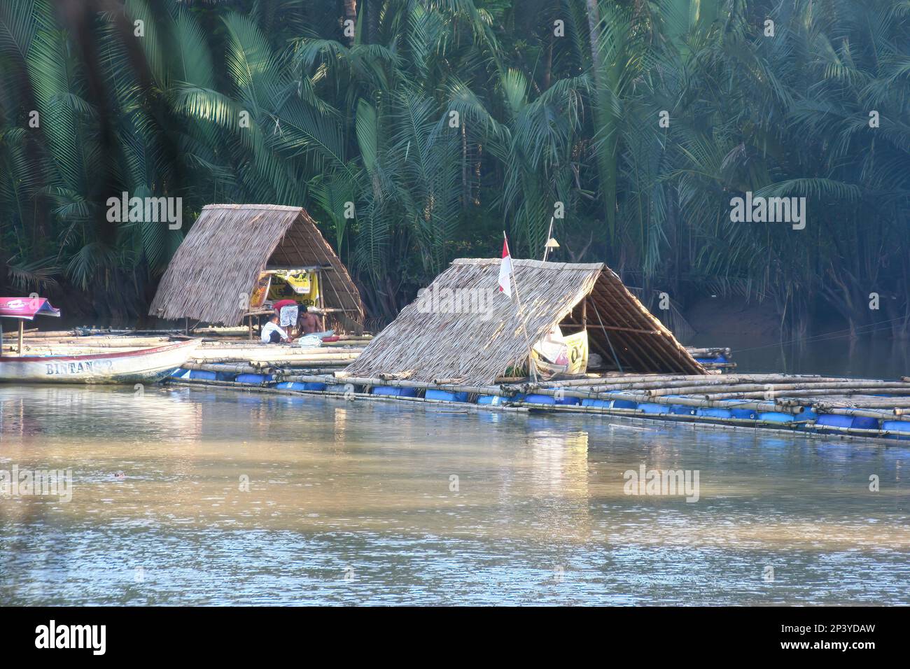 5-1-2009:Java,Indonesia: Boats houses and people on a river in ...