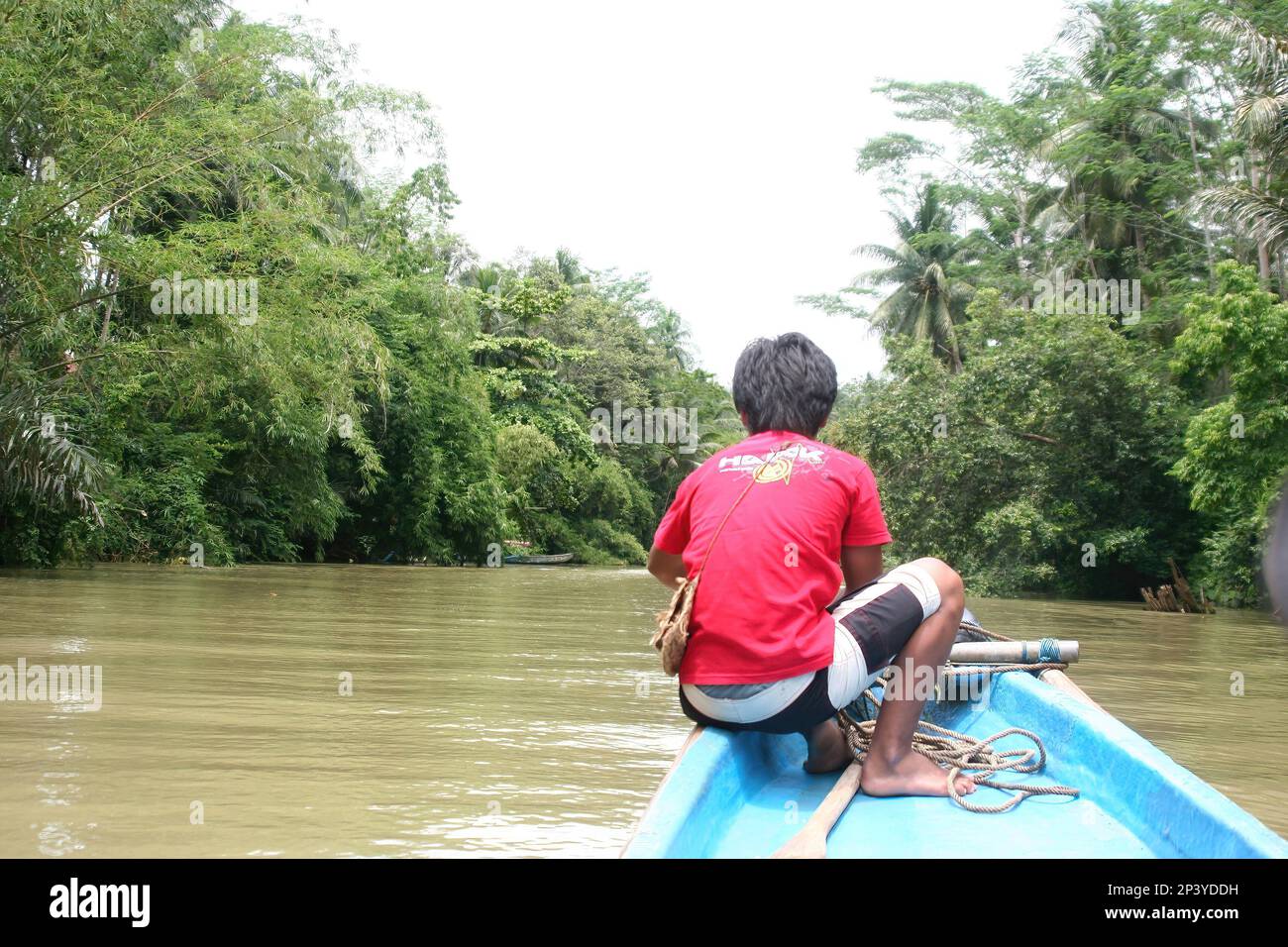 5-1-2009:Java,Indonesia: Boats houses and people on a river in ...