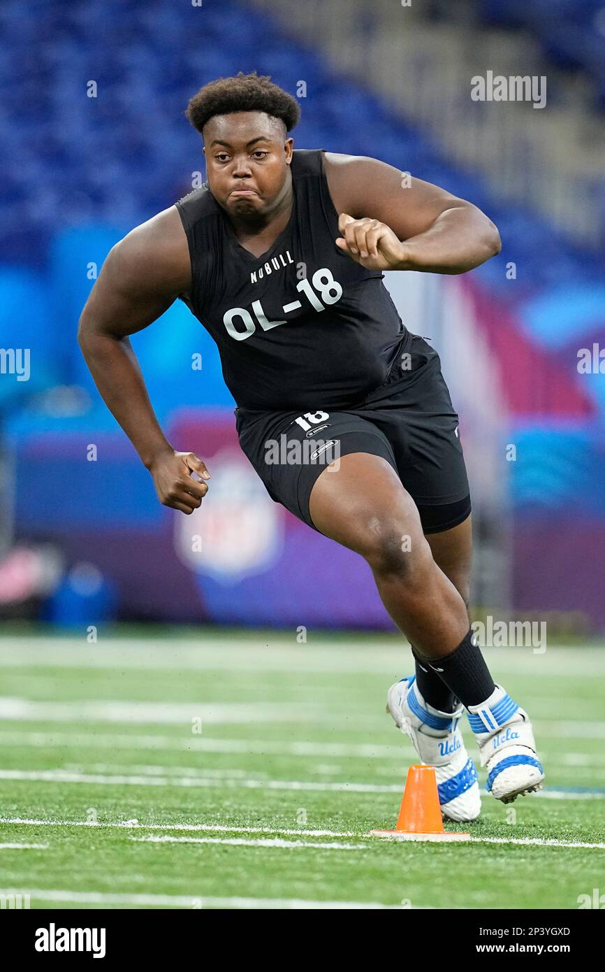 UCLA offensive lineman Jon Gaines II runs a drill at the NFL football ...