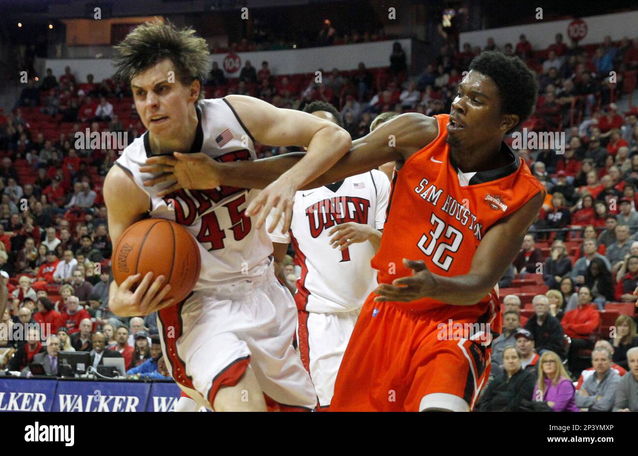 UNLV guard Cody Doolin (45) is covered by Sam Houston State forward ...