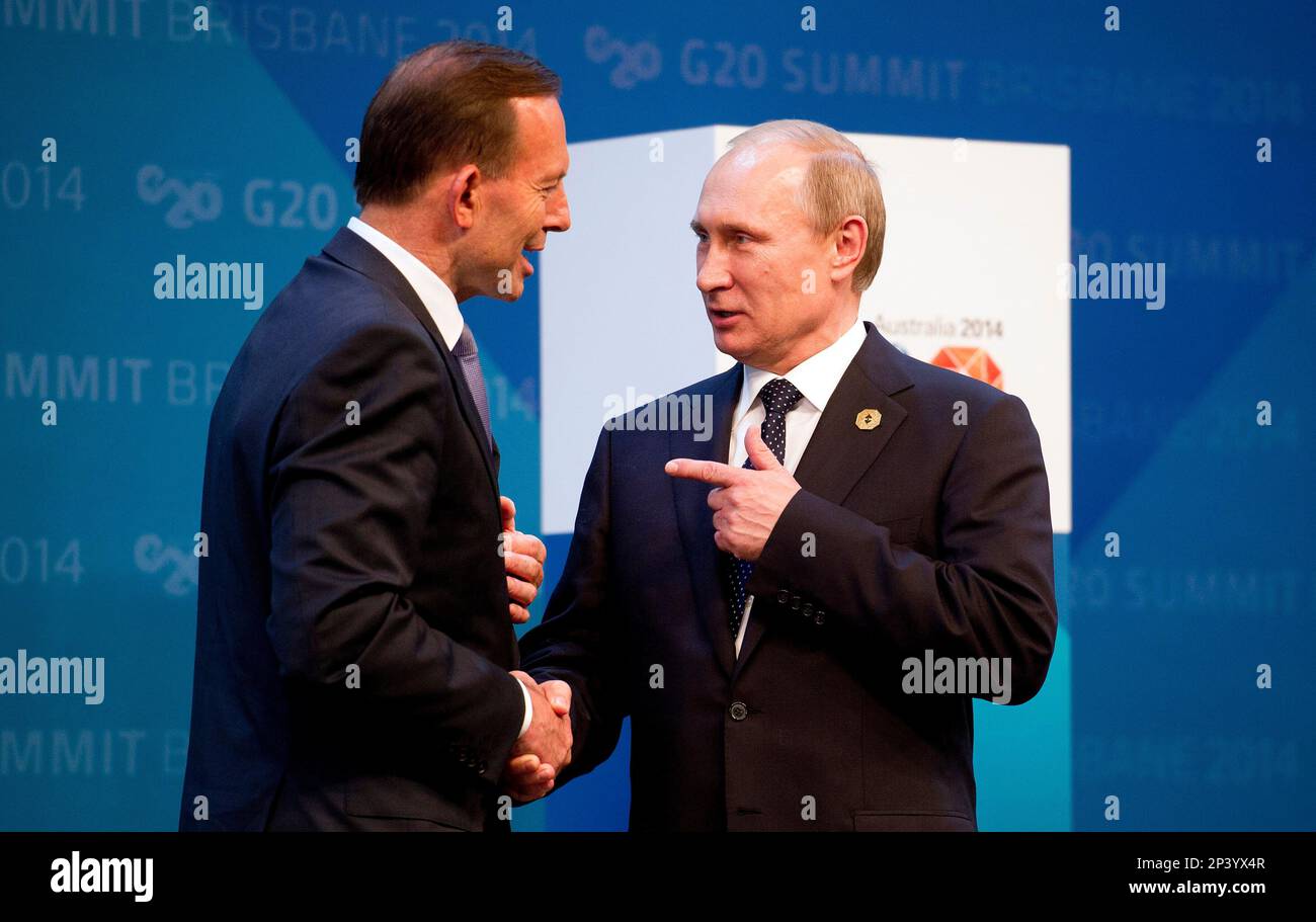 Russia's President Vladimir Putin, right, is welcomed by Australia's ...