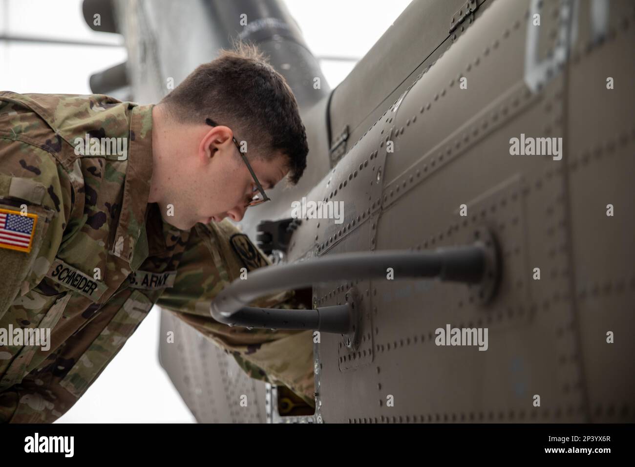 Spc. Justin Schneider, a UH-60 helicopter repairer, Delta Company, 3rd ...
