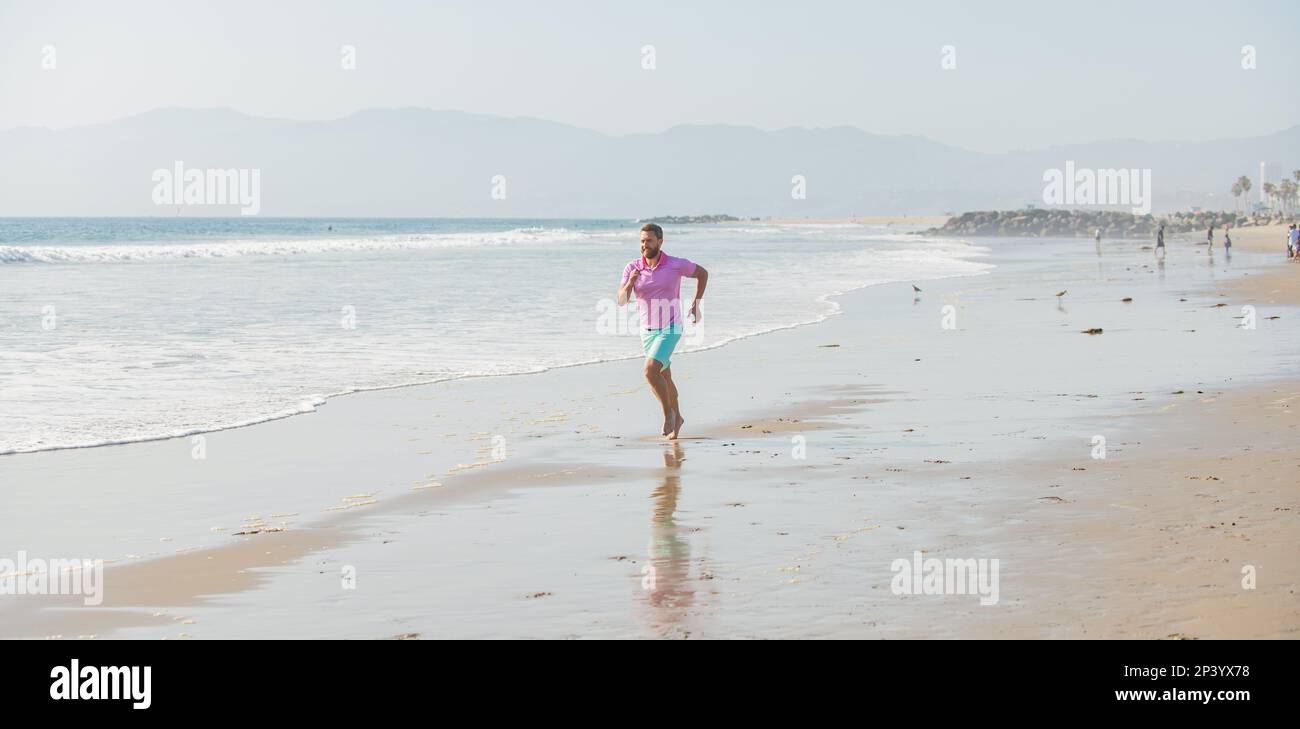 Man running on summer beach hi-res stock photography and images - Alamy
