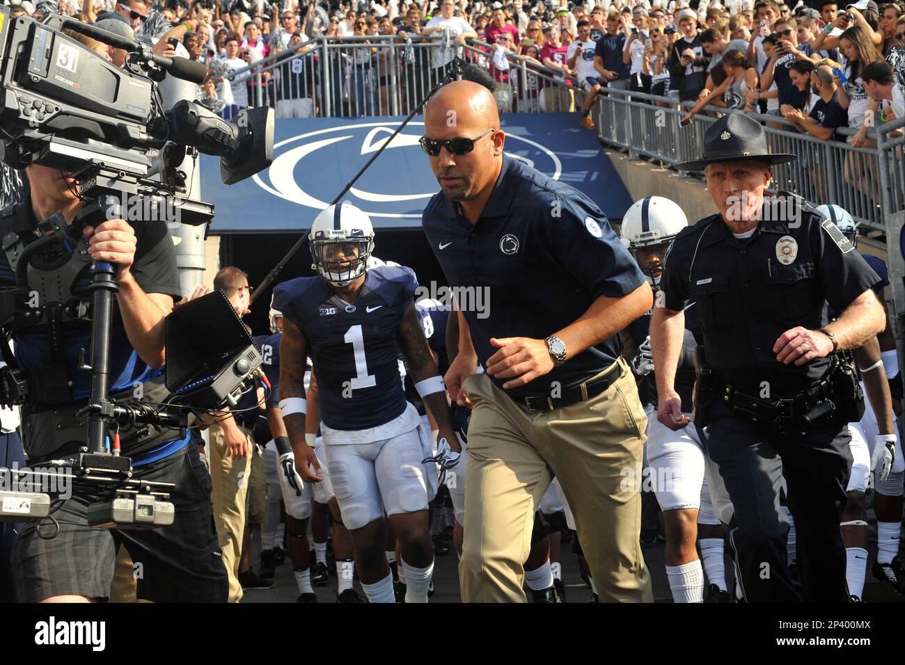 20 September 2014: Penn State head coach James Franklin leads the team ...