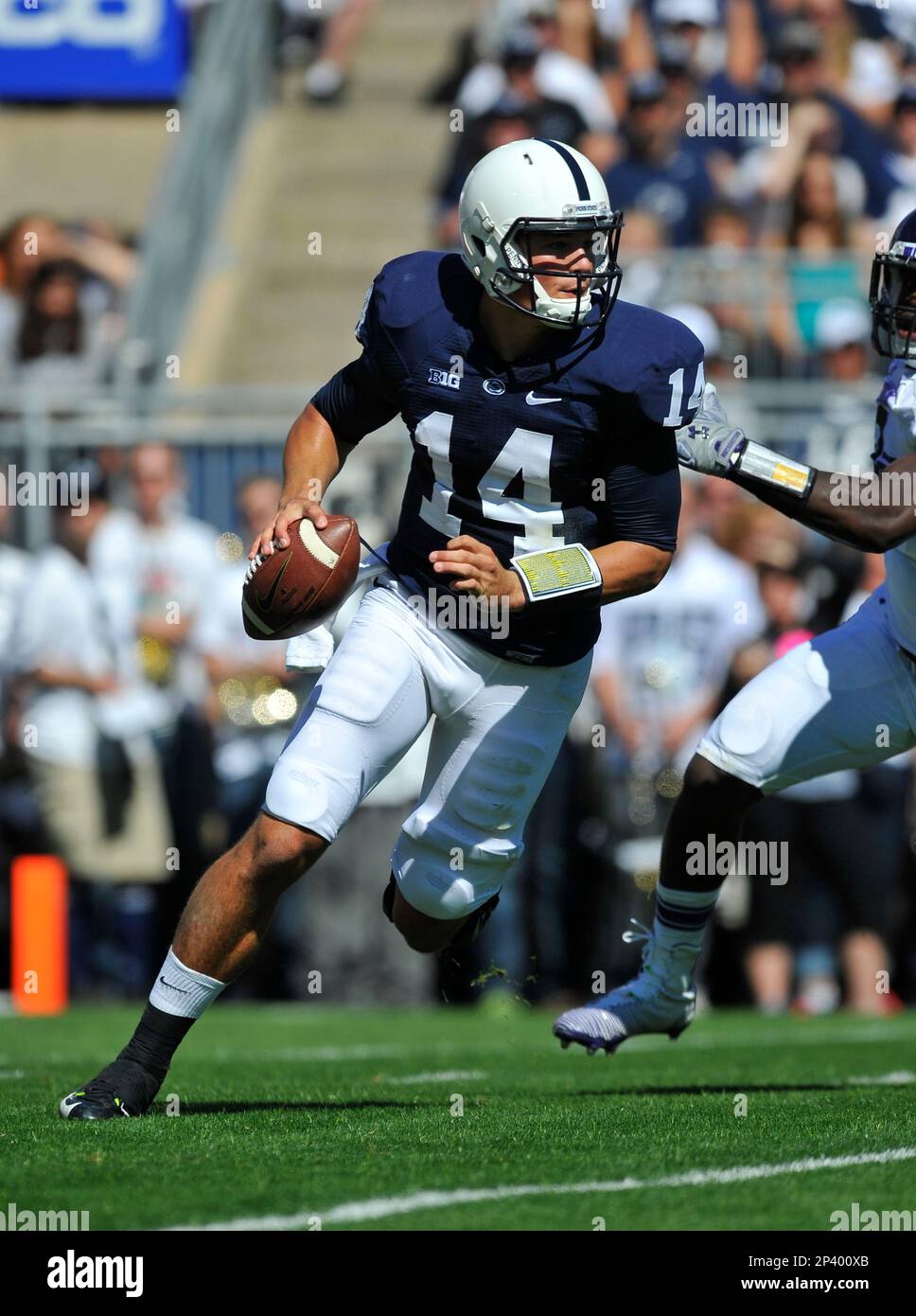 27 September 2014: Penn State QB Christian Hackenberg (14) rolls out ...