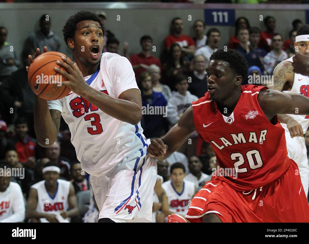 14 November 2014 - SMU Mustangs guard Sterling Brown (#3) and Lamar Cardinals guard Marcus Owens ...