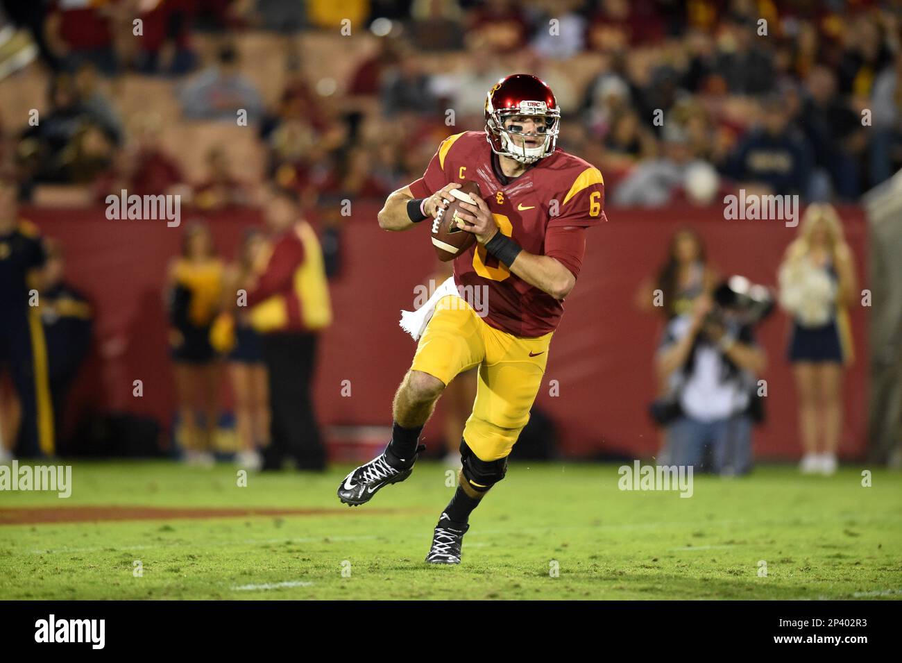 13 November 2014: USC Trojans quarterback Cody Kessler (6) rolls out ...