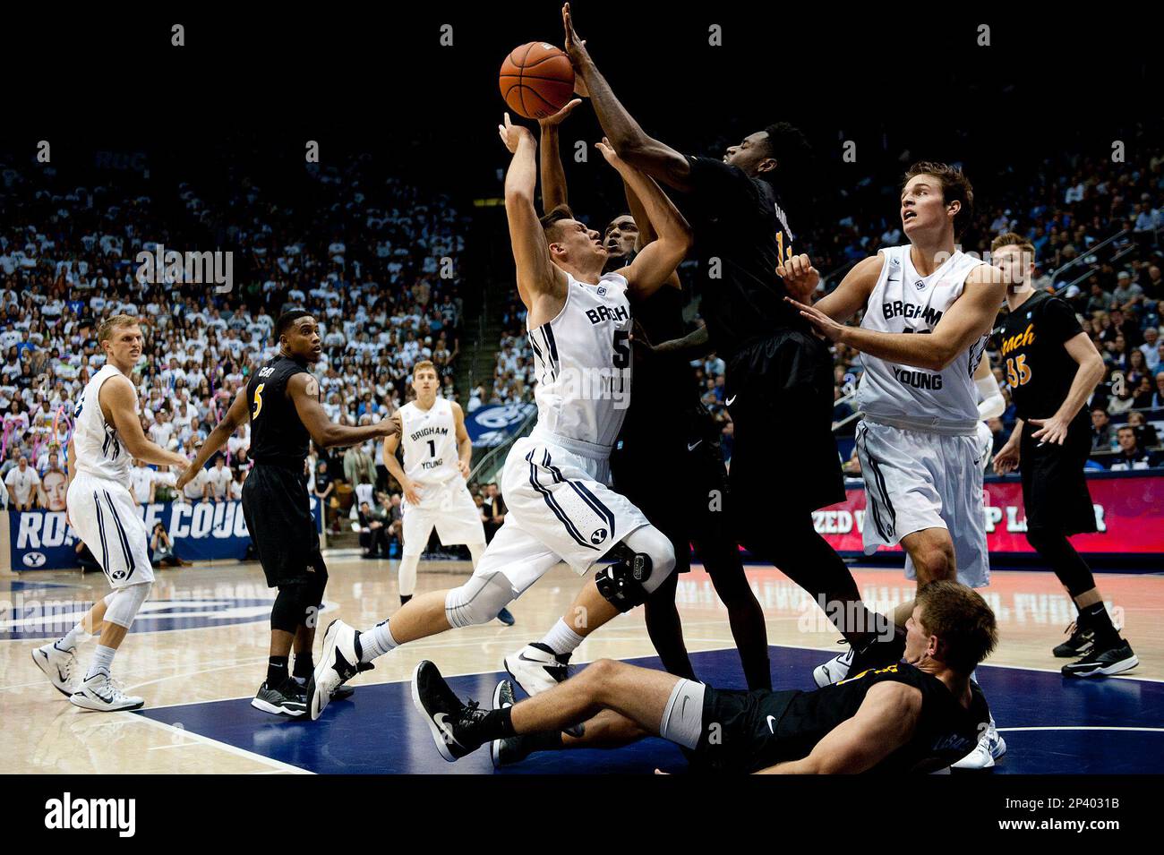 Long Beach State's David Samuels blocks BYU's Kyle Collinsworth during ...