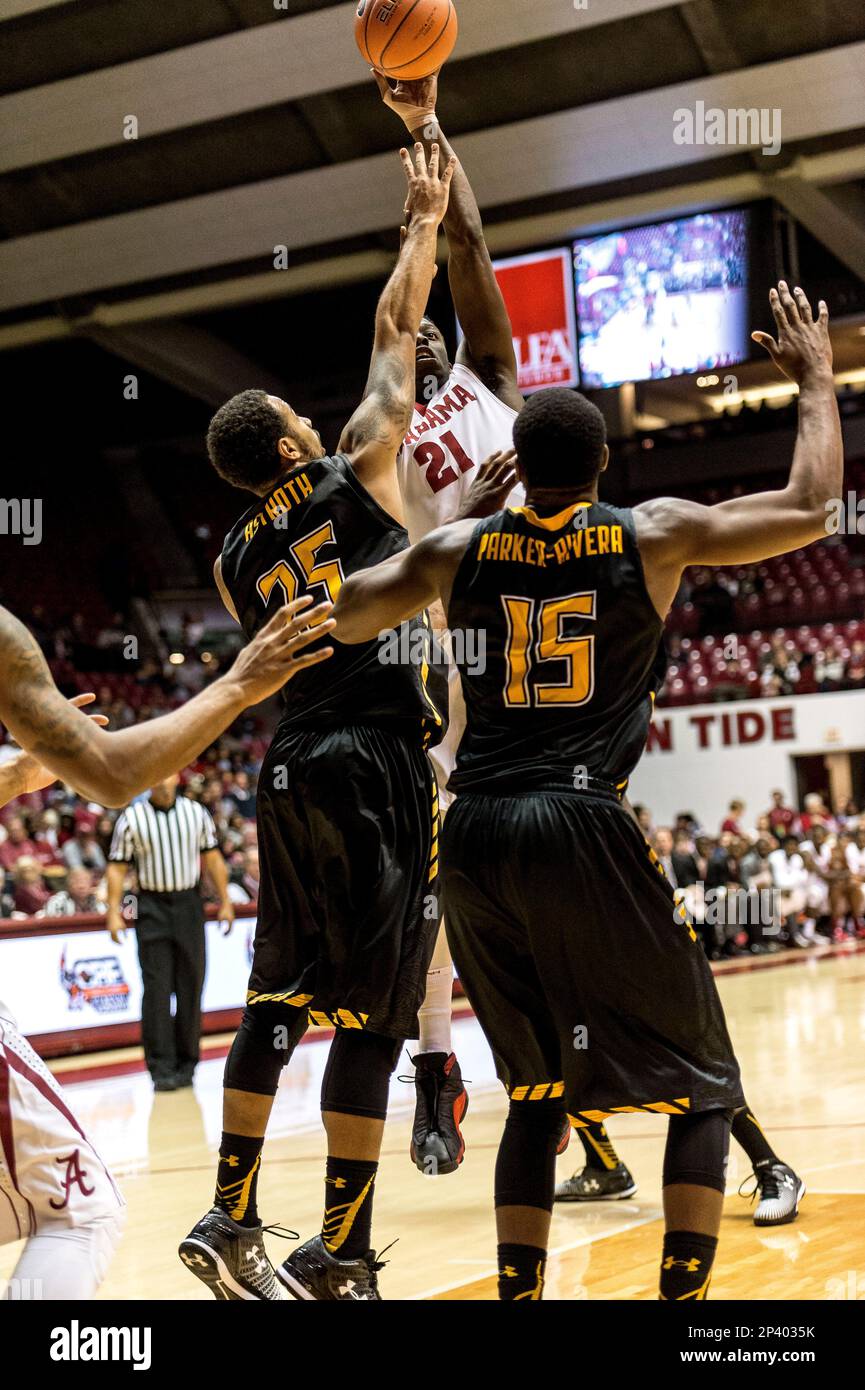 Alabama guard Rodney Cooper (21) battles to get off a shot as Towson ...