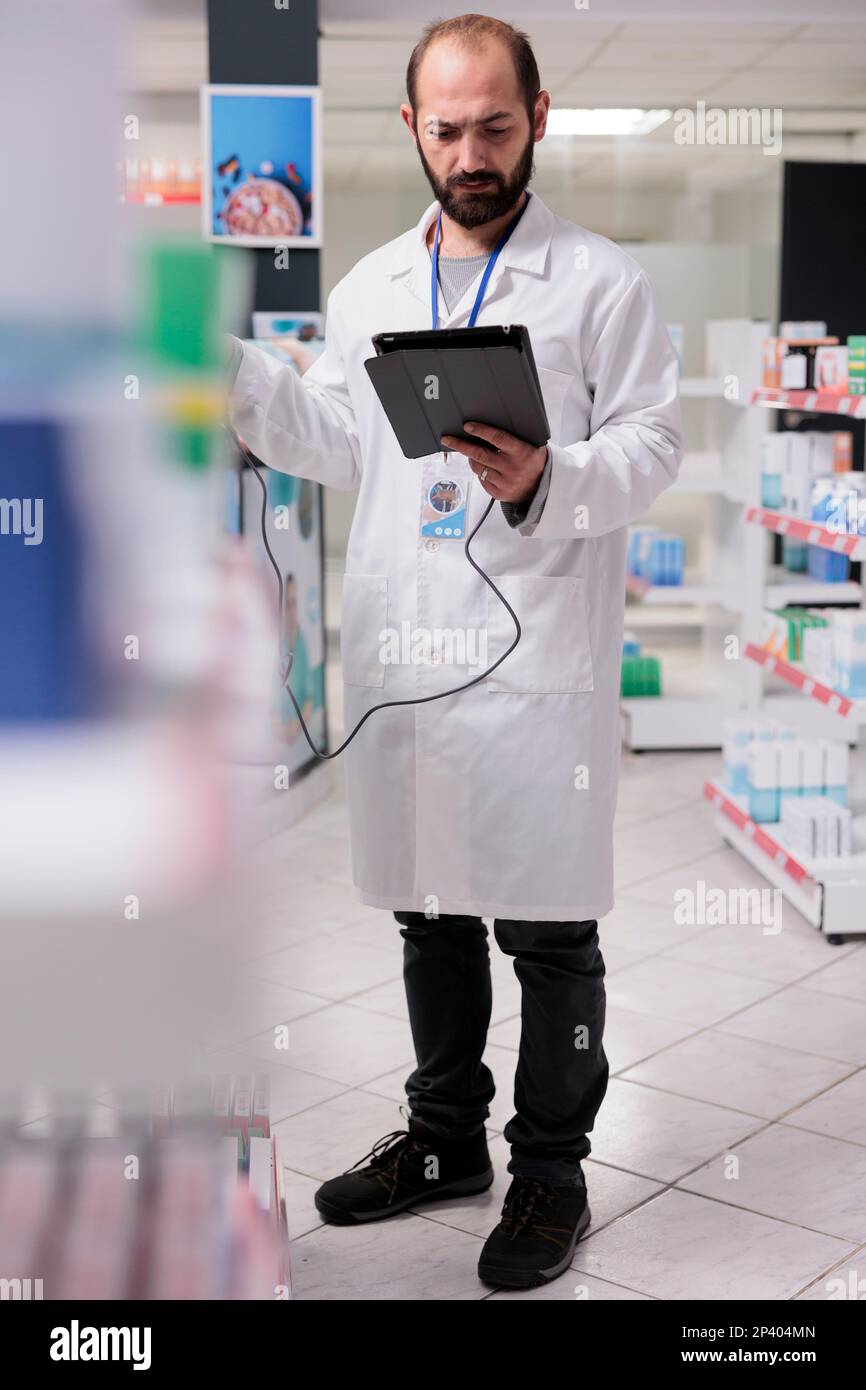 Pharmacist scanning medication scanner hi-res stock photography and ...