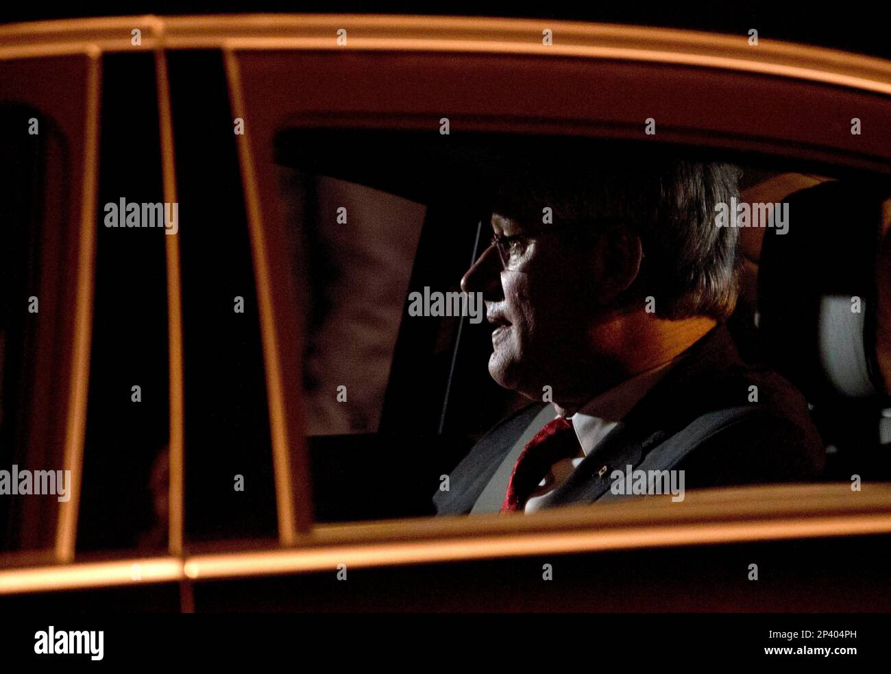 Canada Prime Minister Stephen Harper waits in his car to depart in a ...