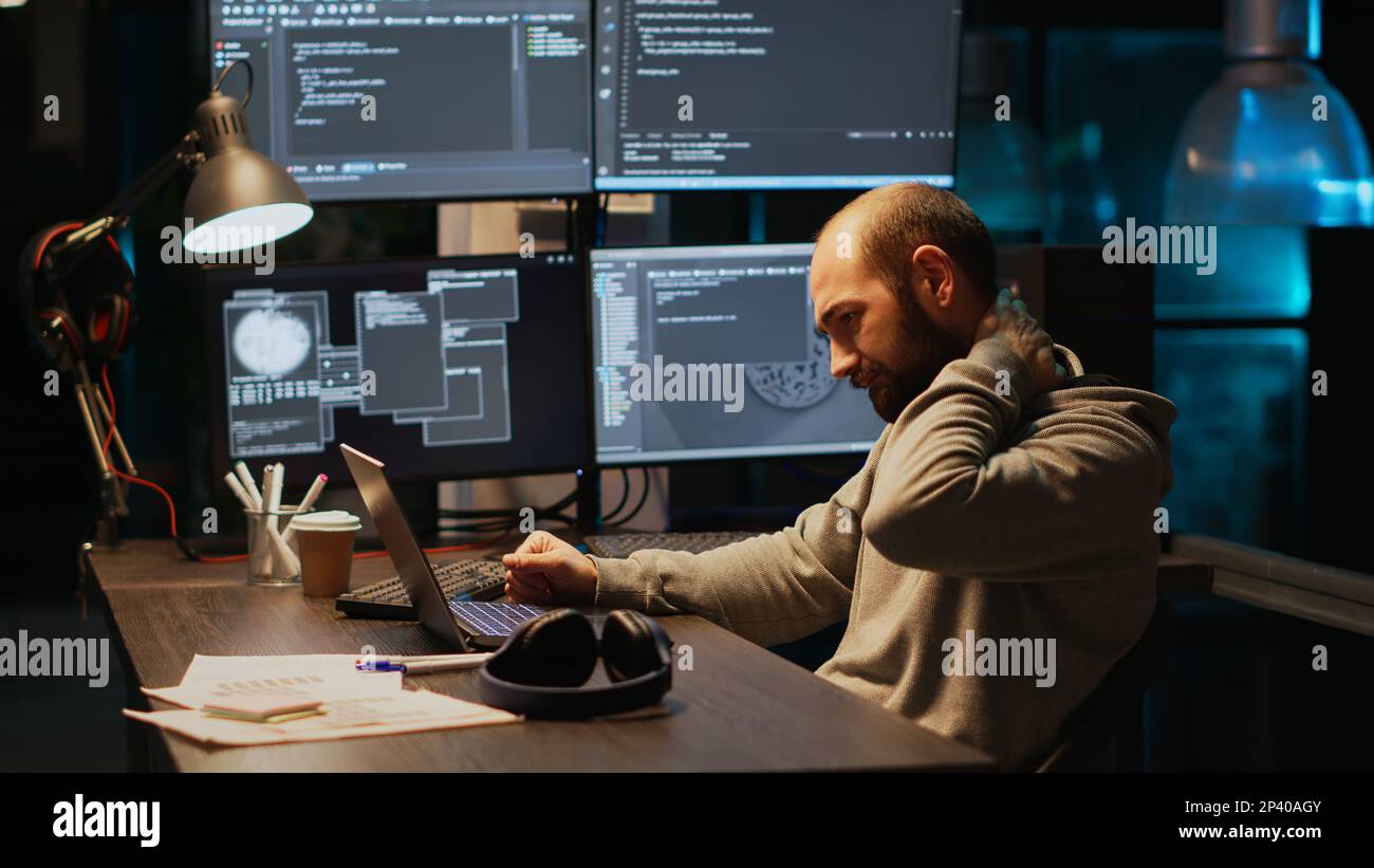 IT engineer suffering from spinal discomfort and working on server ... IT engineer suffering from spinal discomfort and working on server ...