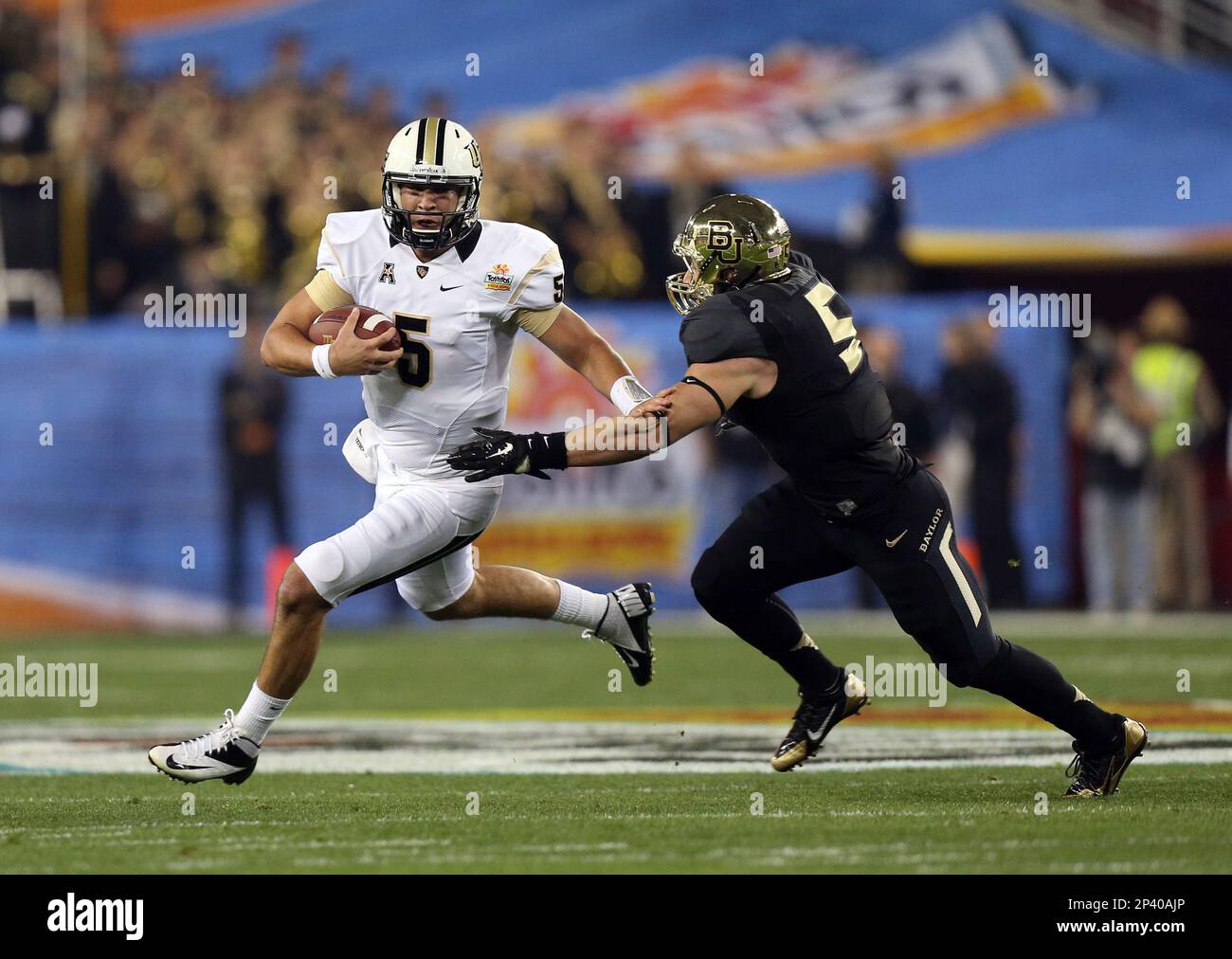 01 January 2014: UCF quarterback Blake Bortles tries to outrun Baylor's ...