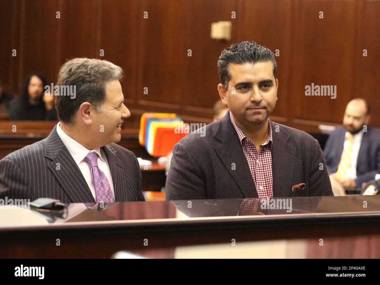 Attorney Carl Scott Spector smiles toward his client, “Cake Boss” star ...