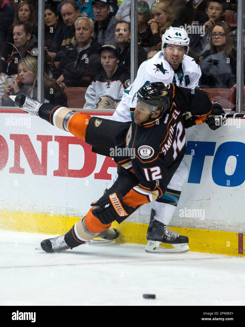 The Ducks' Devante Smith-Pelly, front, falls into the ice as he gets ...